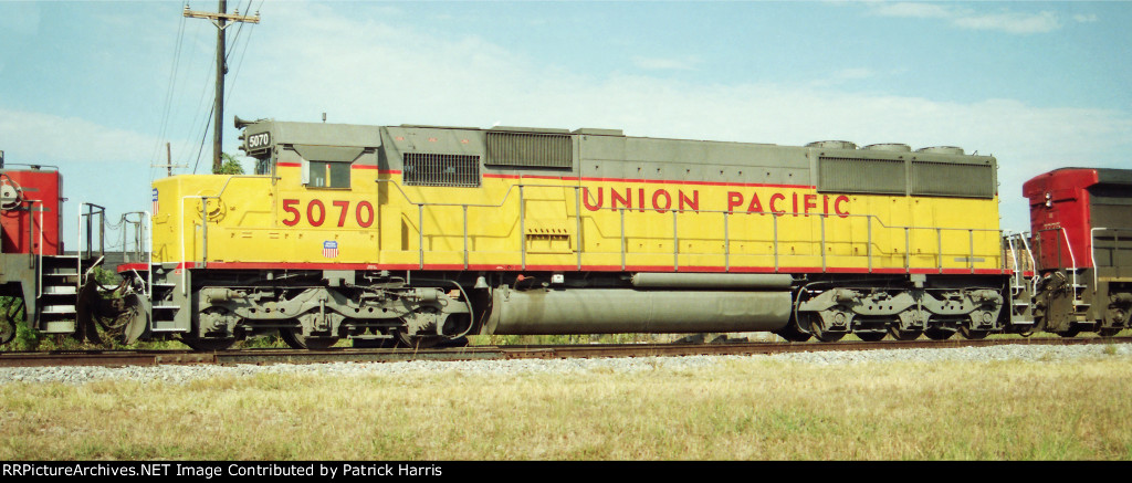 UP 5070 SD50 X-CNW 7010 trails SSW 7775 B30-7 with a UP intermodal eastbound approaching Oliver ...